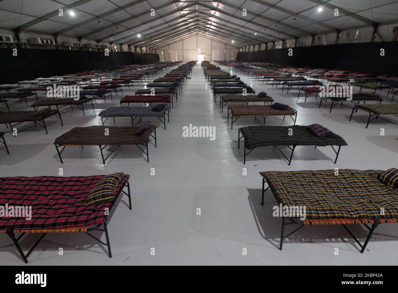 Beds are seen inside a makeshift isolation center for COVID-19 patients ...