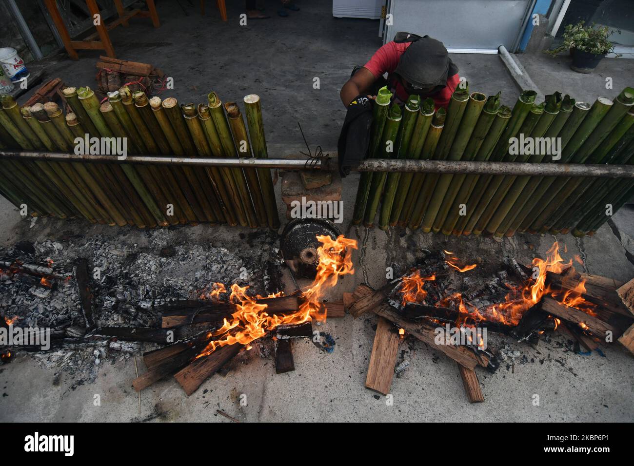 Residents roast rice mixed with traditional spices and filled into ...