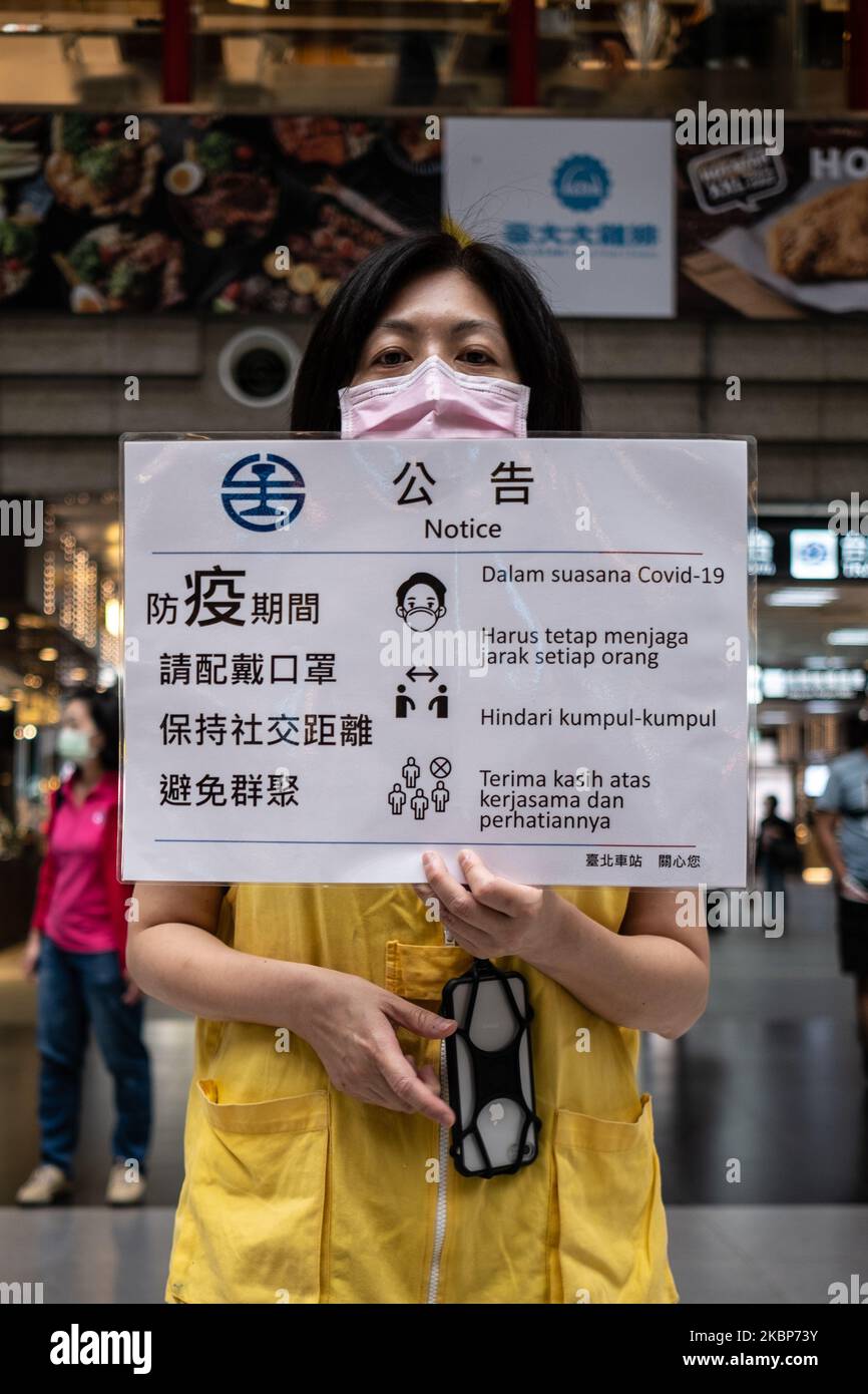 TRA employee holding a placard to remember the protesters t hold social ...