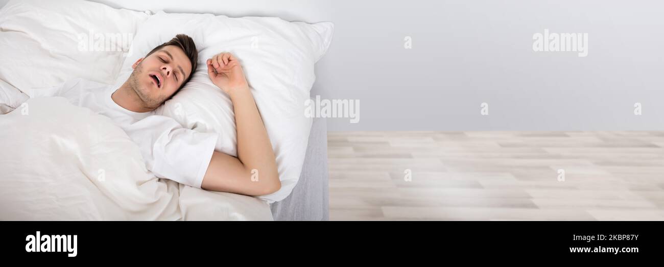 Man Snoring While Sleeping. Young Person On Pillow Stock Photo - Alamy Man Snoring While Sleeping. Young Person On Pillow Stock Photo - Alamy