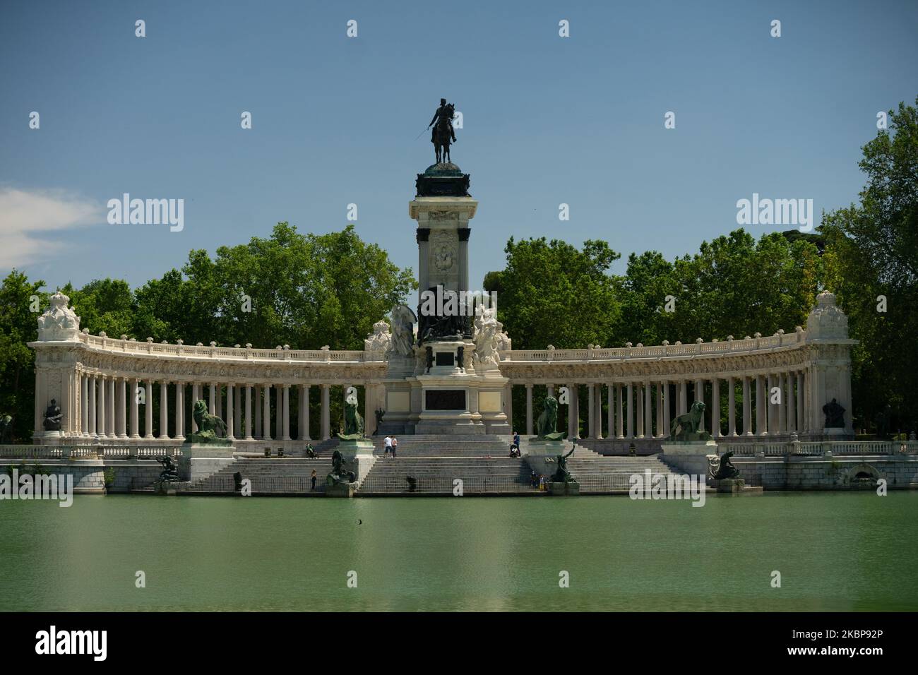 People enjoy at the Retiro Park in Madrid on May 25, 2020 as the gates ...