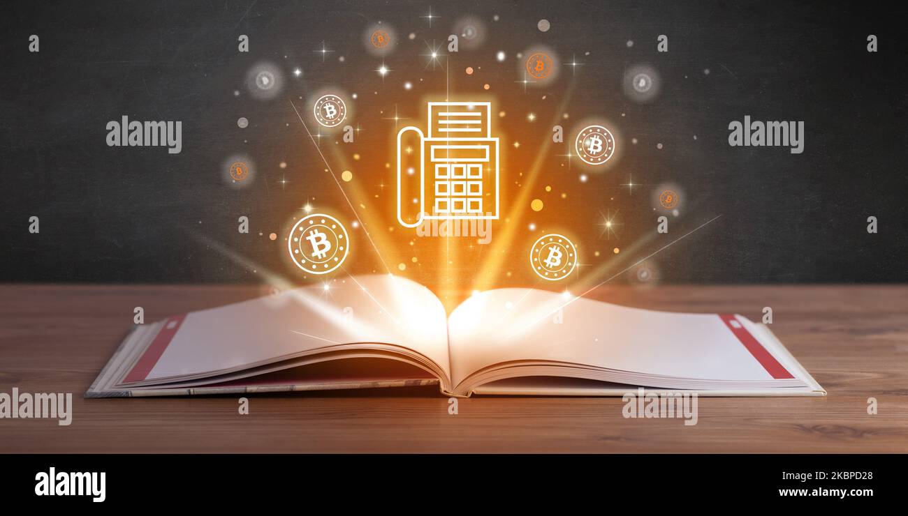 Open book with currency icons above Stock Photo - Alamy
