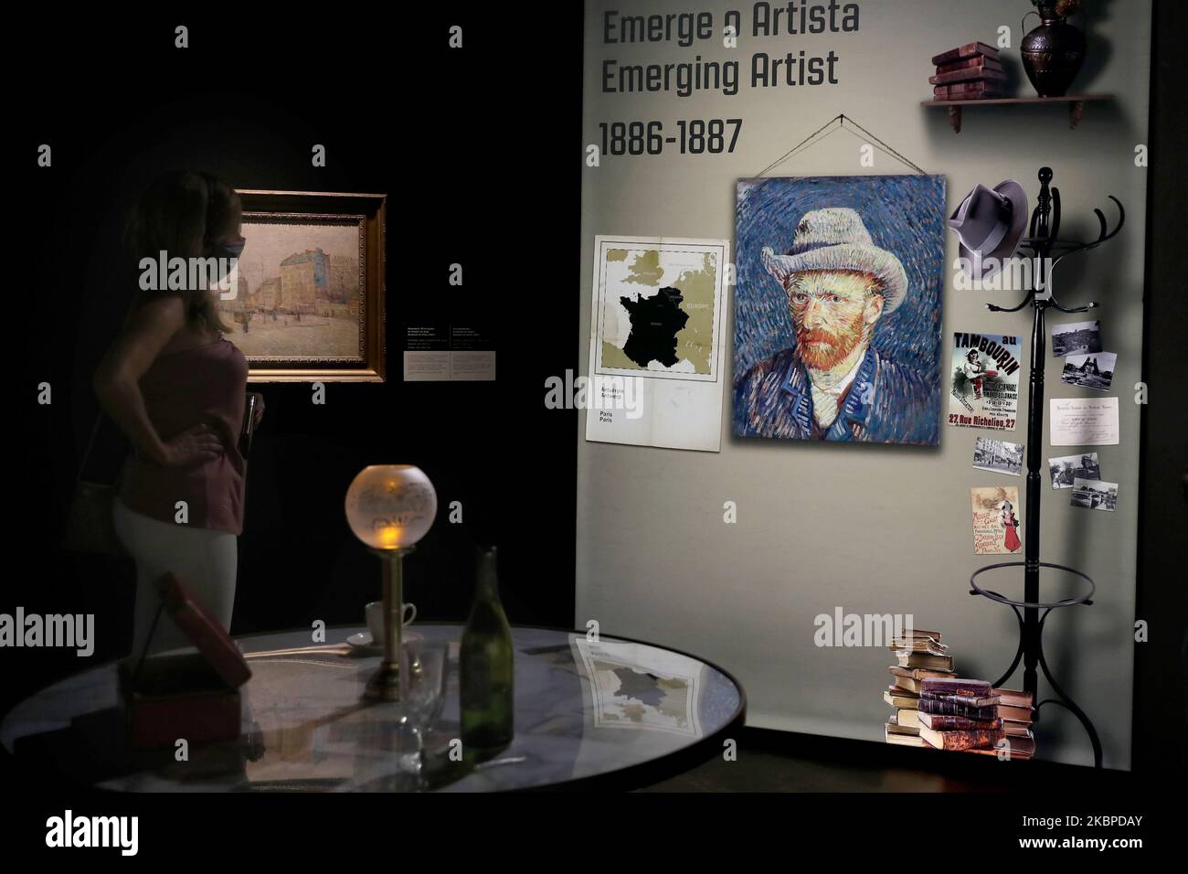 A visitor wearing a face mask attends the â€ Meet Vincent Van Gogh ...