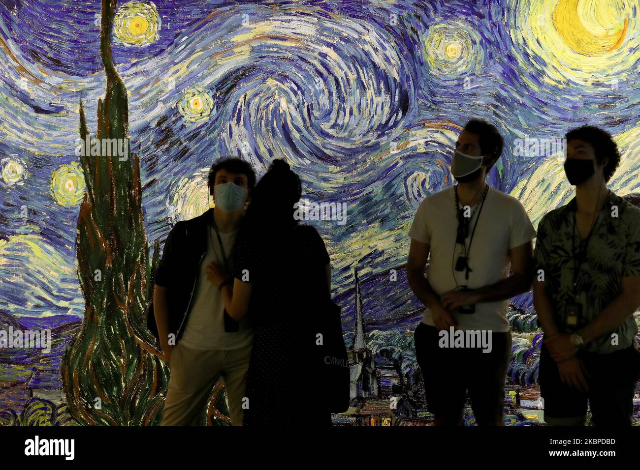 Visitors wearing face masks attend the â€ Meet Vincent Van Gogh ...