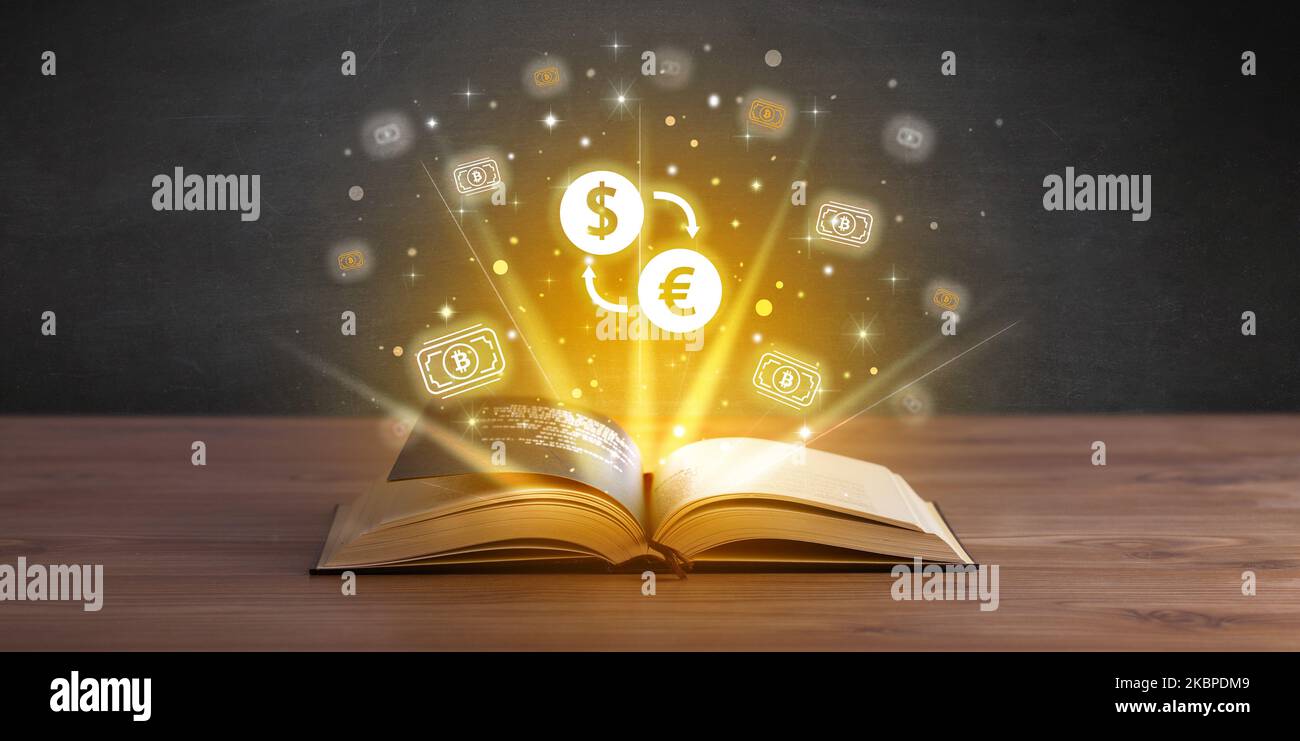 Open book with currency icons above Stock Photo - Alamy