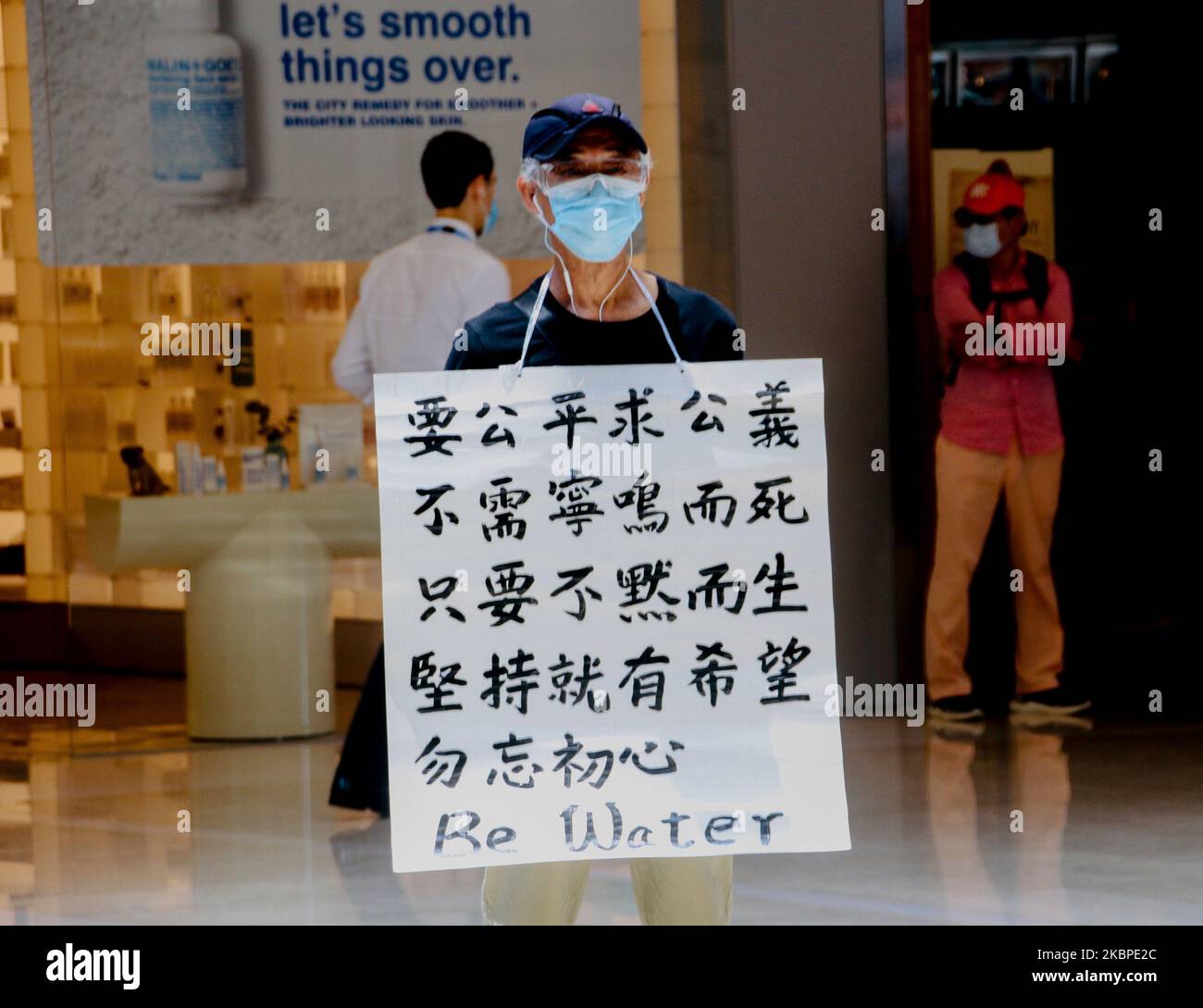 A man holds ‘Be Water’ sign - a popular slogan used during the pro ...