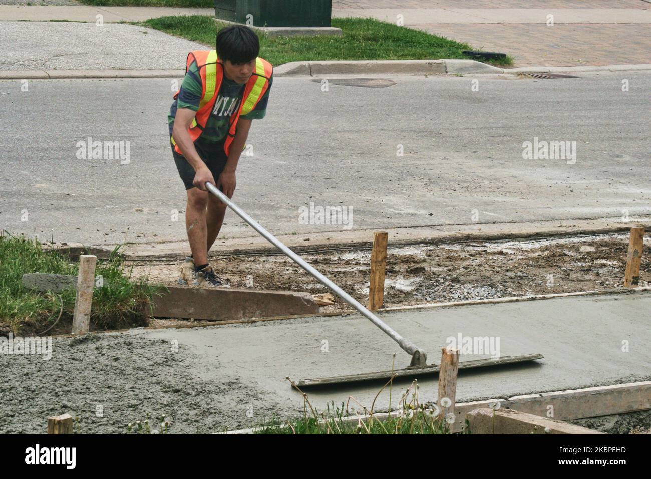 Sidewalk construction in Toronto, Ontario, Canada. (Photo by Creative ...