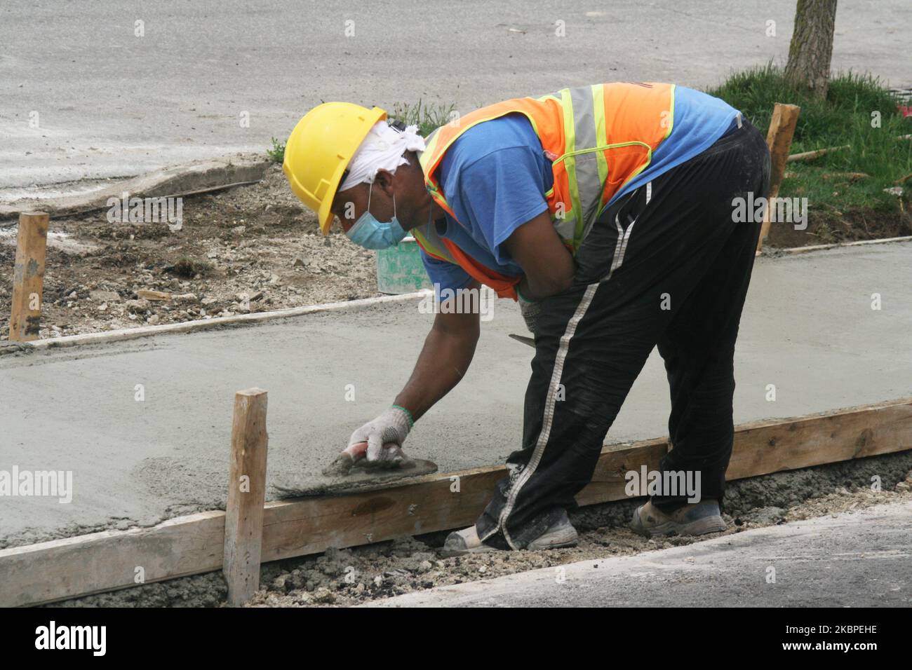 Sidewalk construction in Toronto, Ontario, Canada. (Photo by Creative ...