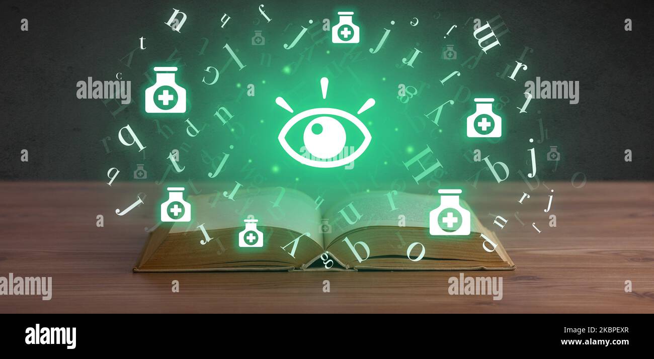 Open medical book with health icons above Stock Photo - Alamy