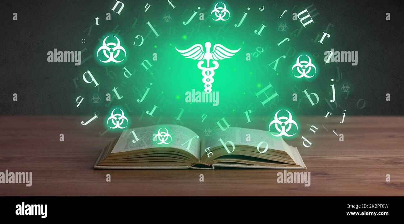 Open medical book with health icons above Stock Photo - Alamy