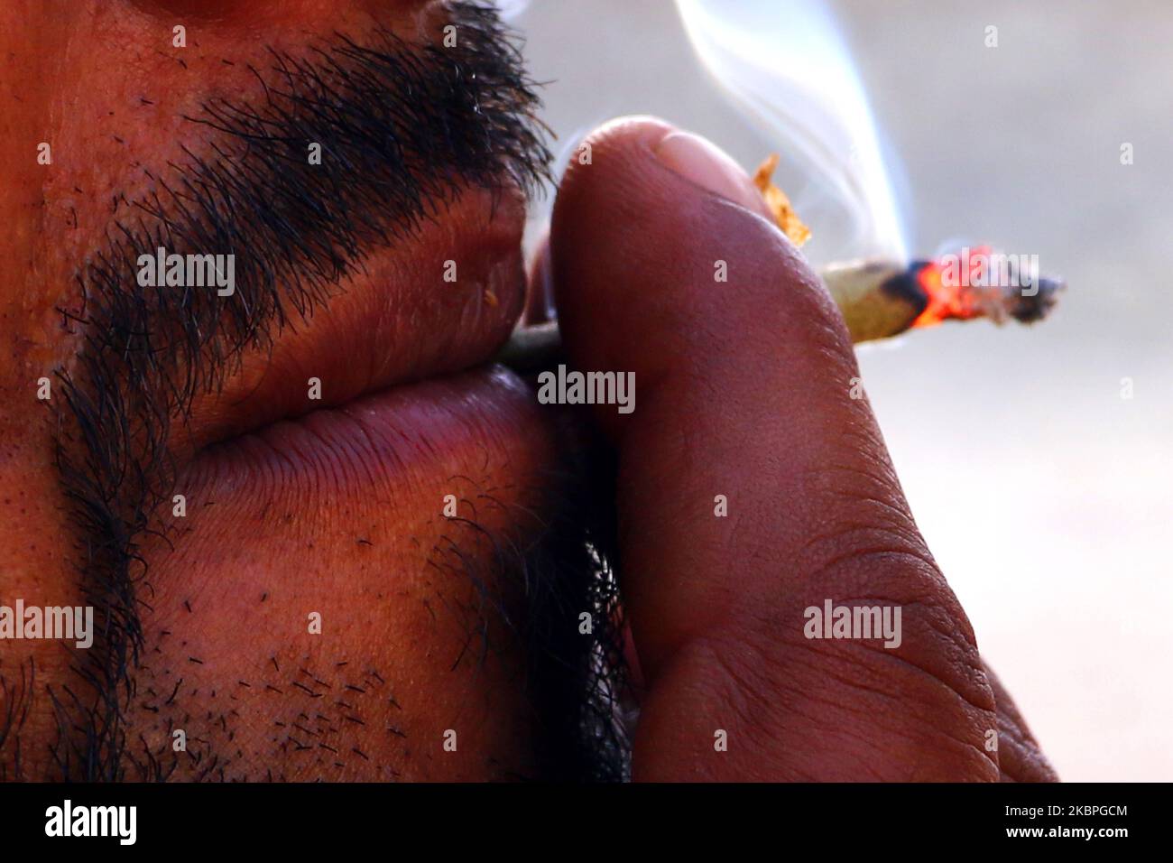 A Man Smokes 'Bidi' a Small Hand Rolled Cigarette on World No Tobacco ...