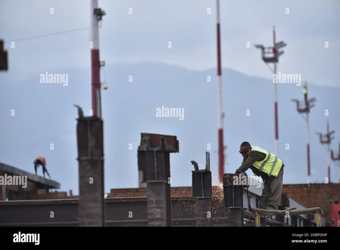 Nepalese workers installing fundamentals in the Tribhuwan International ...