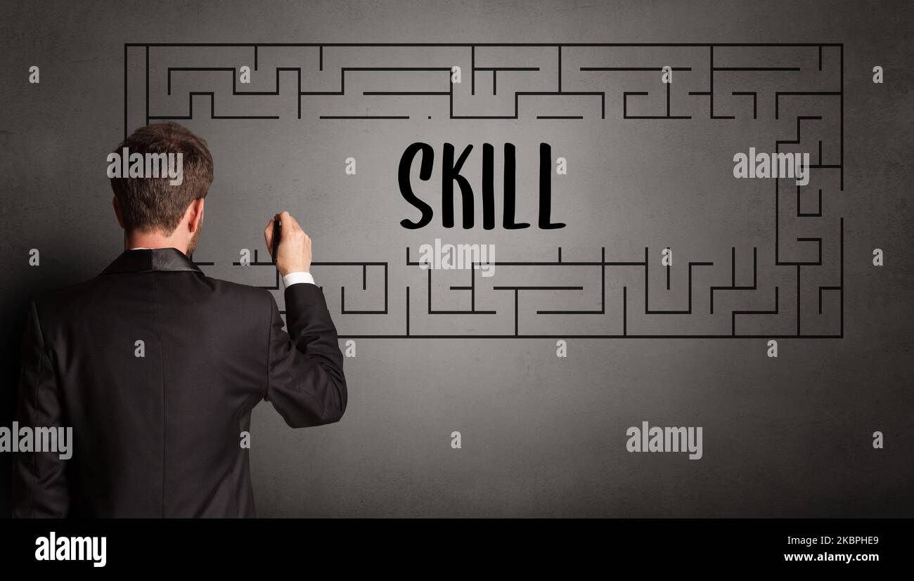 businessman drawing maze concept Stock Photo - Alamy