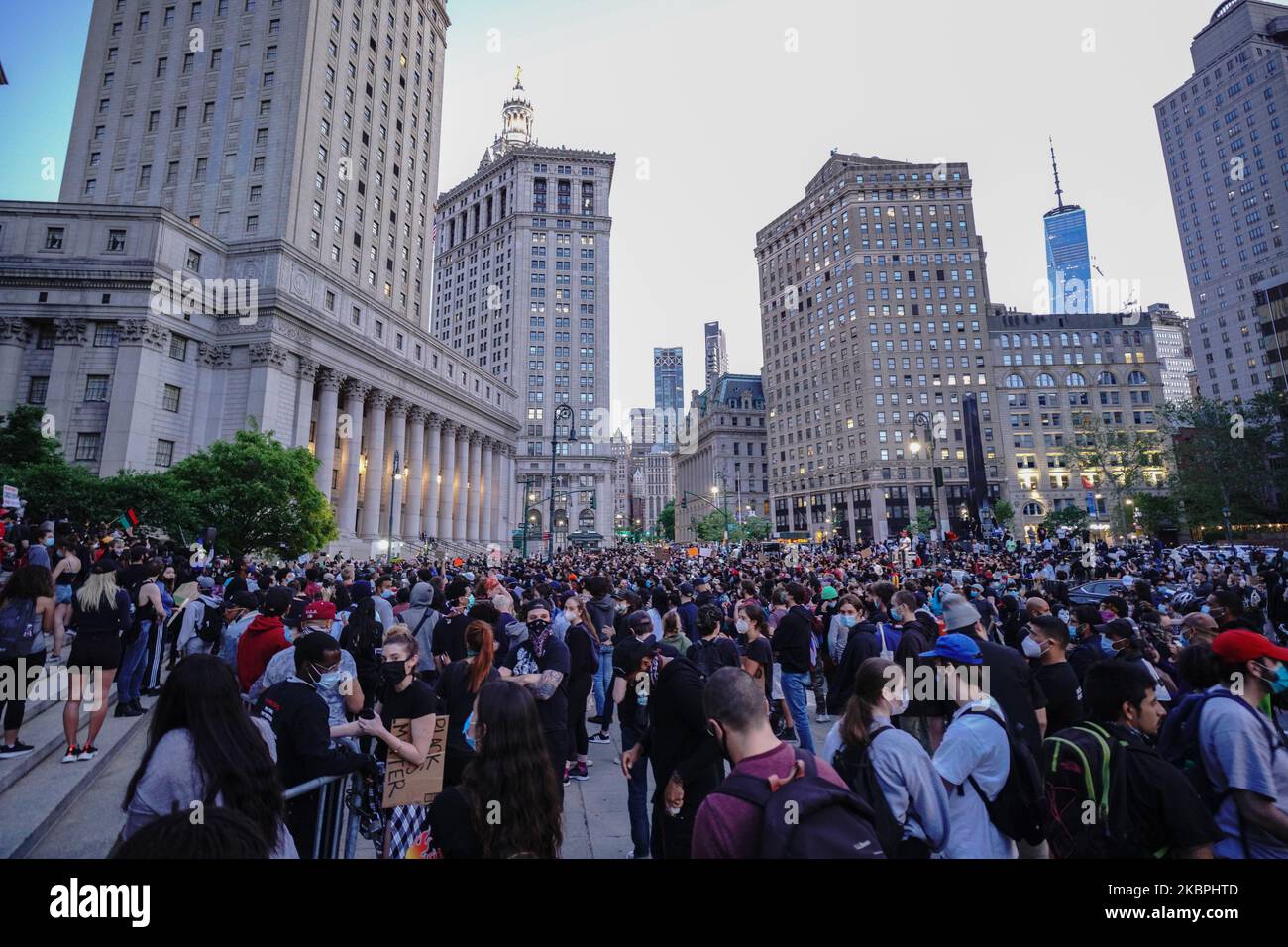 Protestors are seen in front of City Hall as they rally against the ...