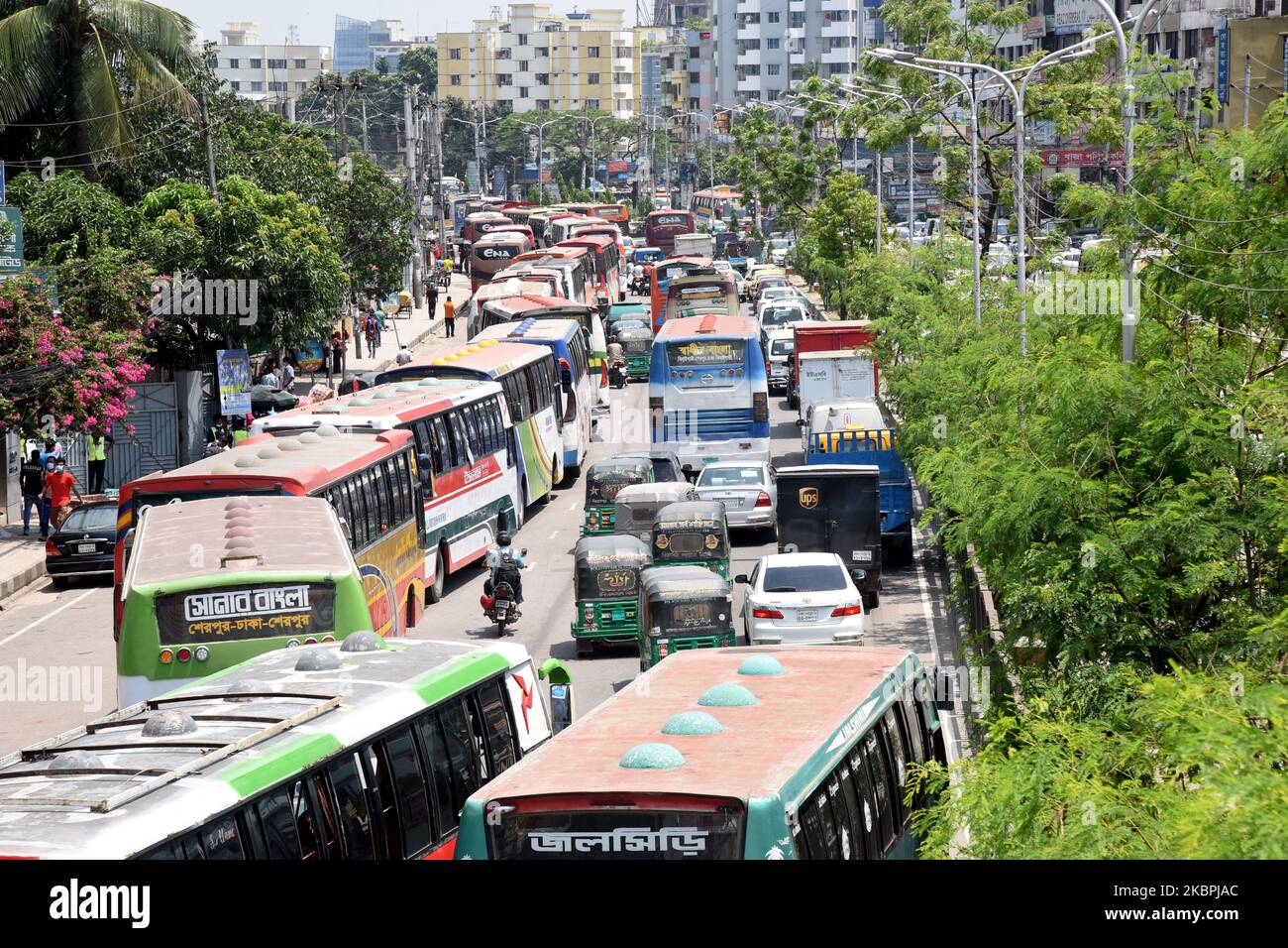 Traffic jam and public transports are seen along a street after ended a ...
