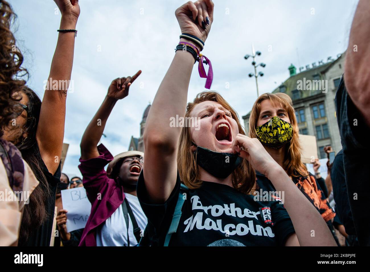 A white woman is screaming, during the massive solidarity protest ...