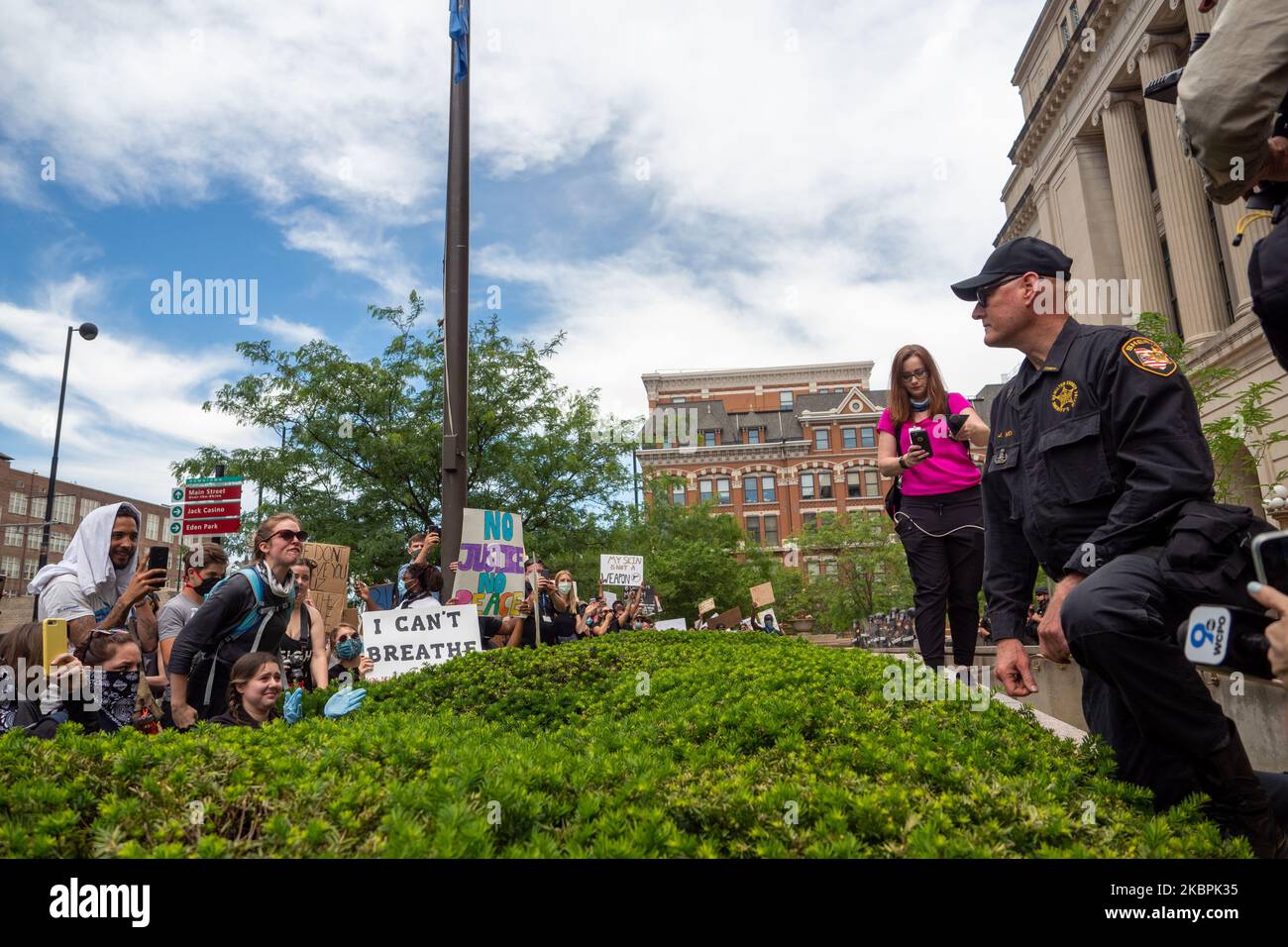 Hamilton County Sheriff Jim Neil takes a knee with protestors as ...