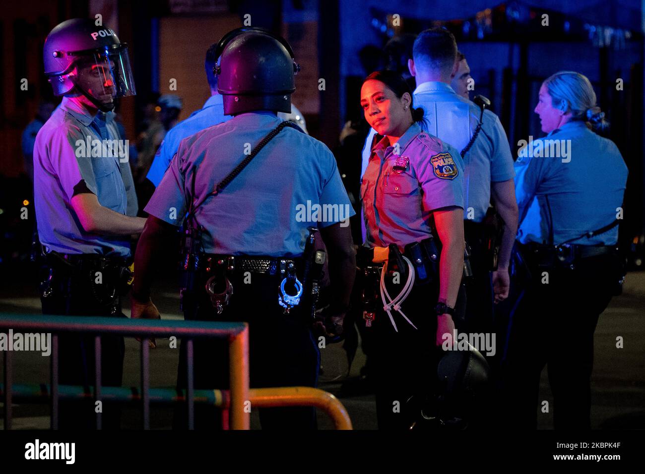Philadelphia uniformed police and SWAT units prepare to move in and ...