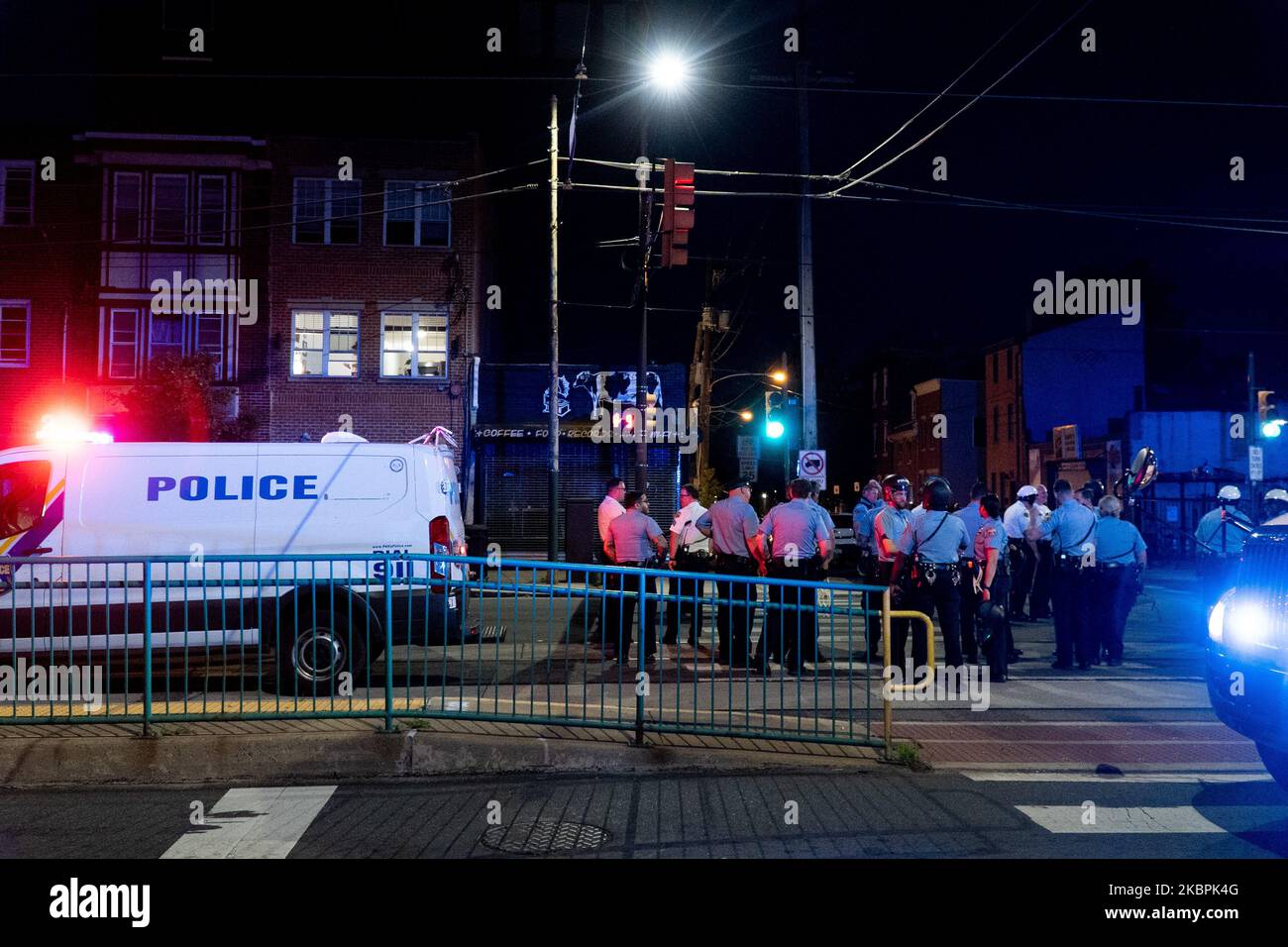 Philadelphia uniformed police and SWAT units prepare to move in and ...