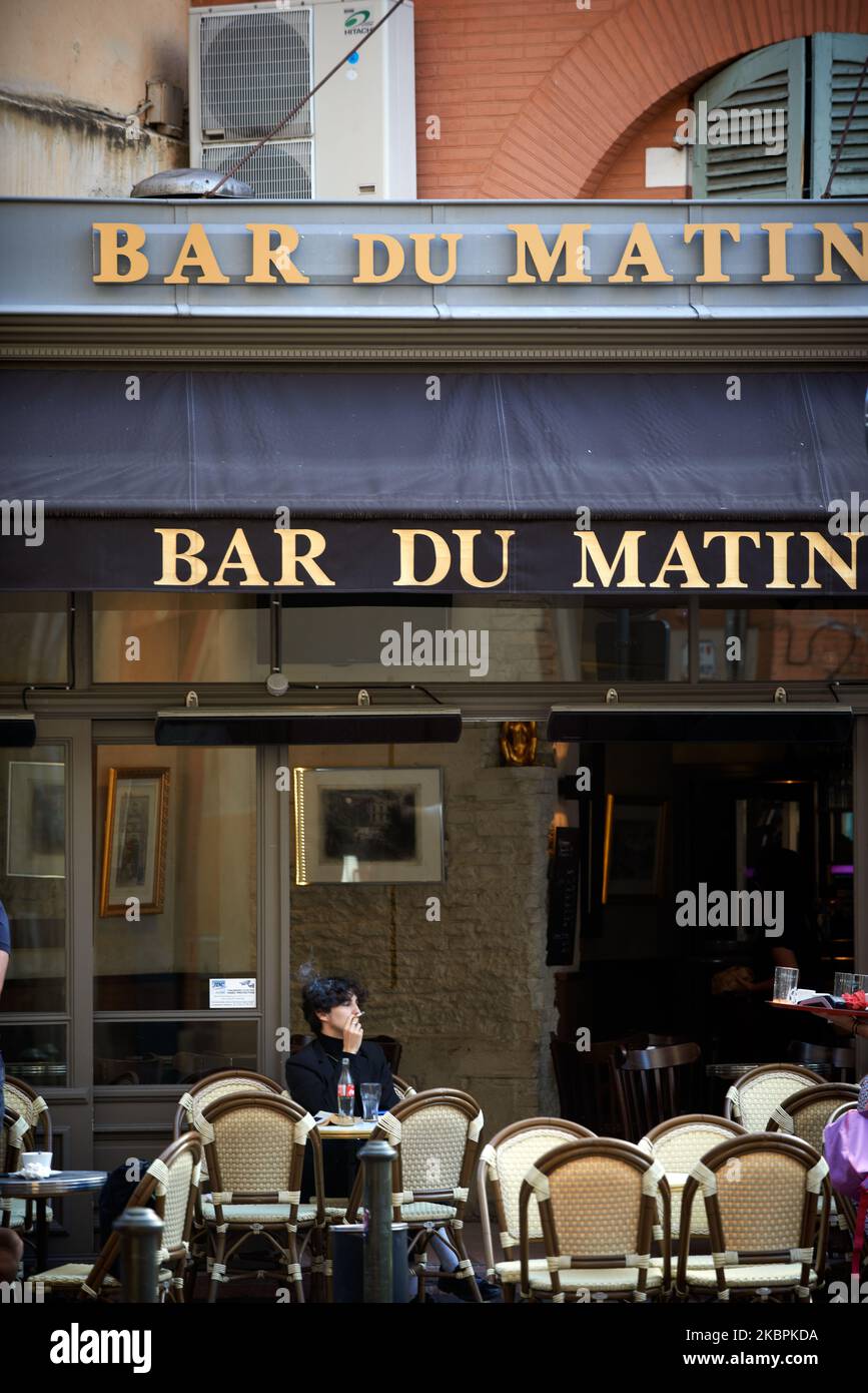 People enjoy their first coffee on a cafe's terrace. This one is called ...