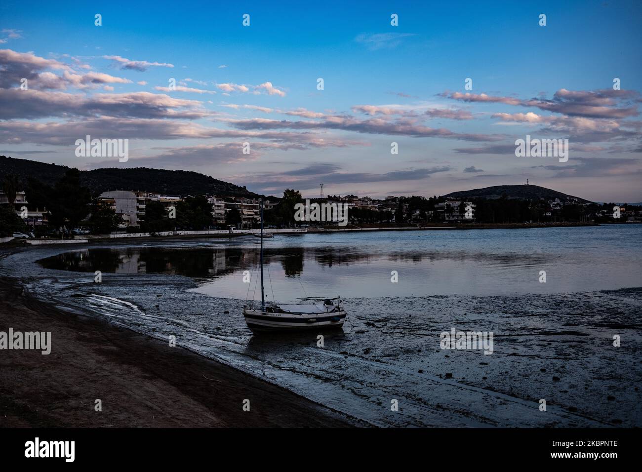 Low tide in the port of Nea Artaki just before sunset in Nea Artaki ...