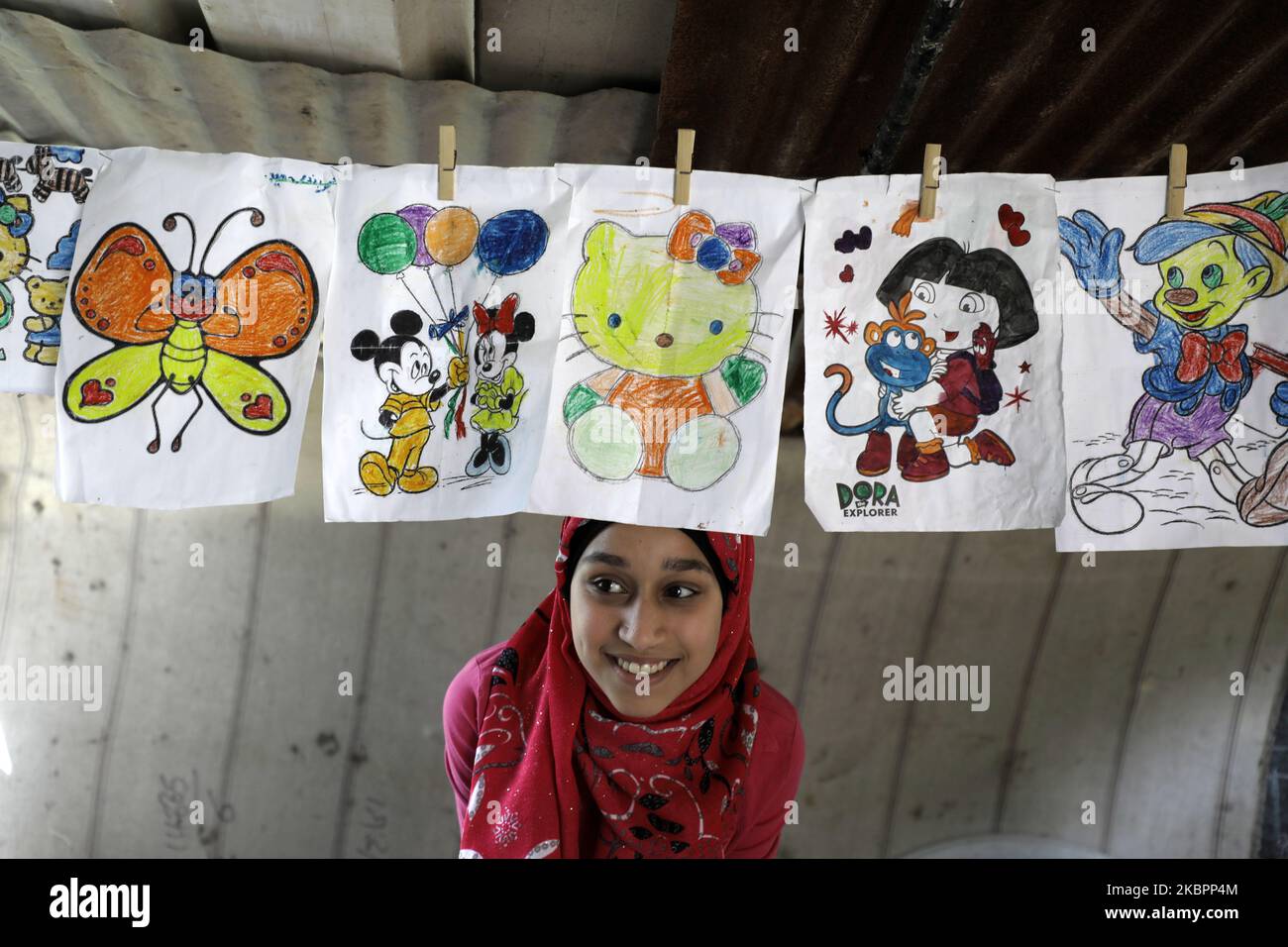A Palestinian school girl Fajr Hmaid, 13, teaches her neighbours ...