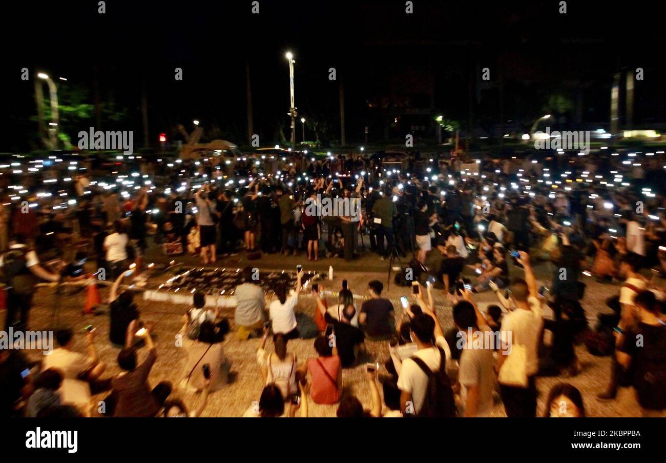 Hundreds of participants attend a candlelight vigil at Democracy Square ...