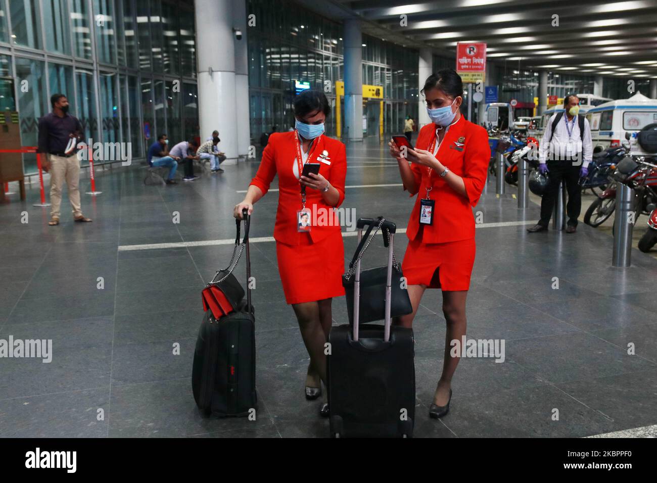 AirAsia Airlines Air hostess wearing protective mask watch on his ...