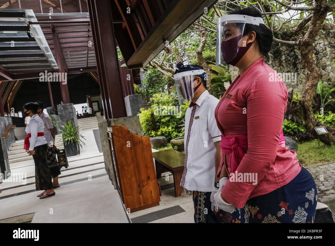 Hotel staffs wearing face mask, gloves and face shield as a health ...