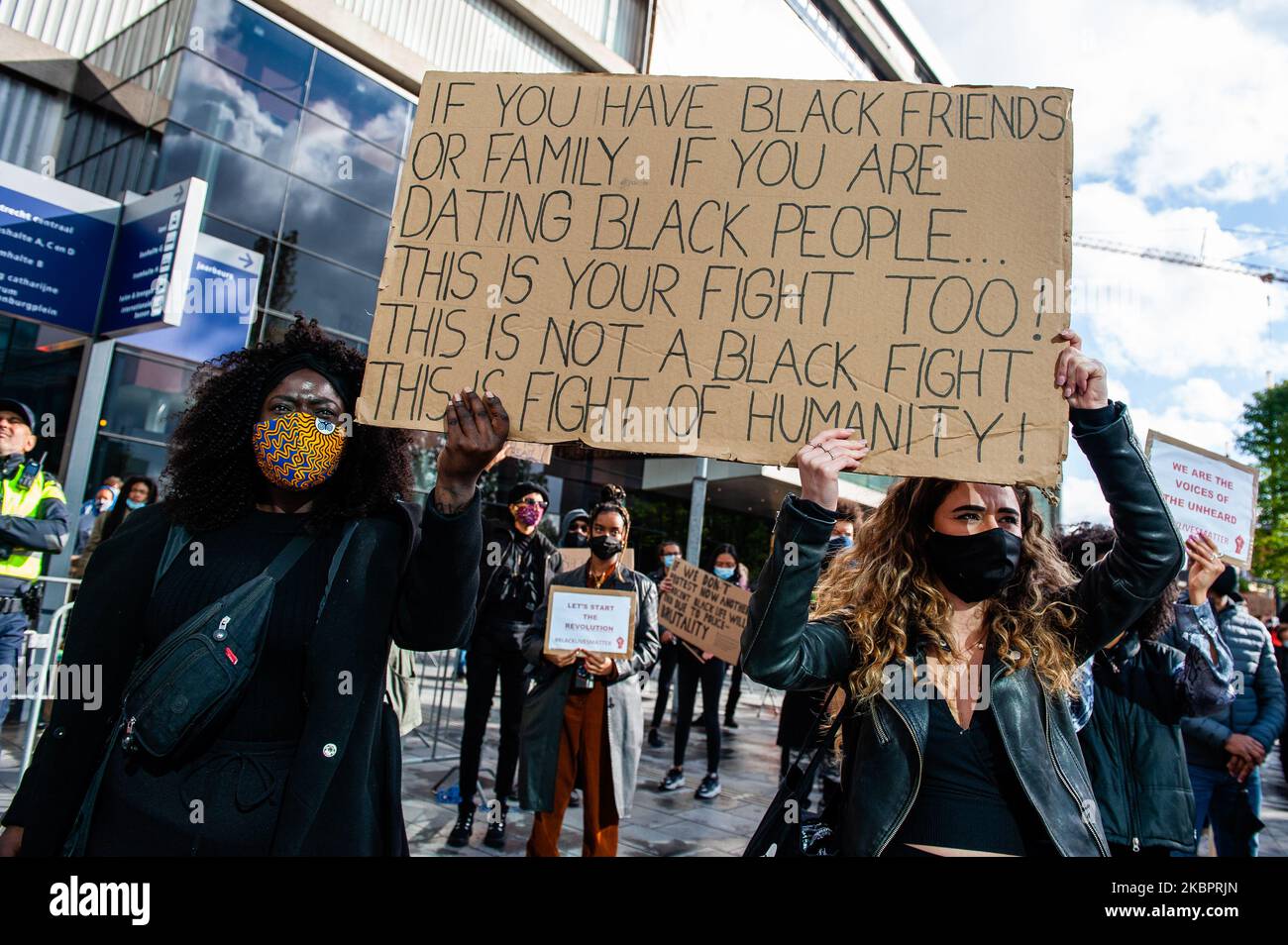 Two women are holding an anti racist placard, during the massive ...