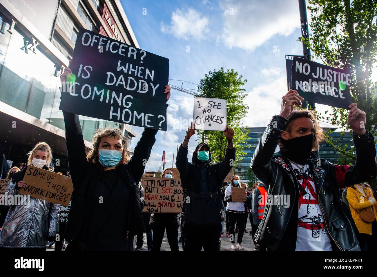A group of people are holding anti racist placards, during the massive ...