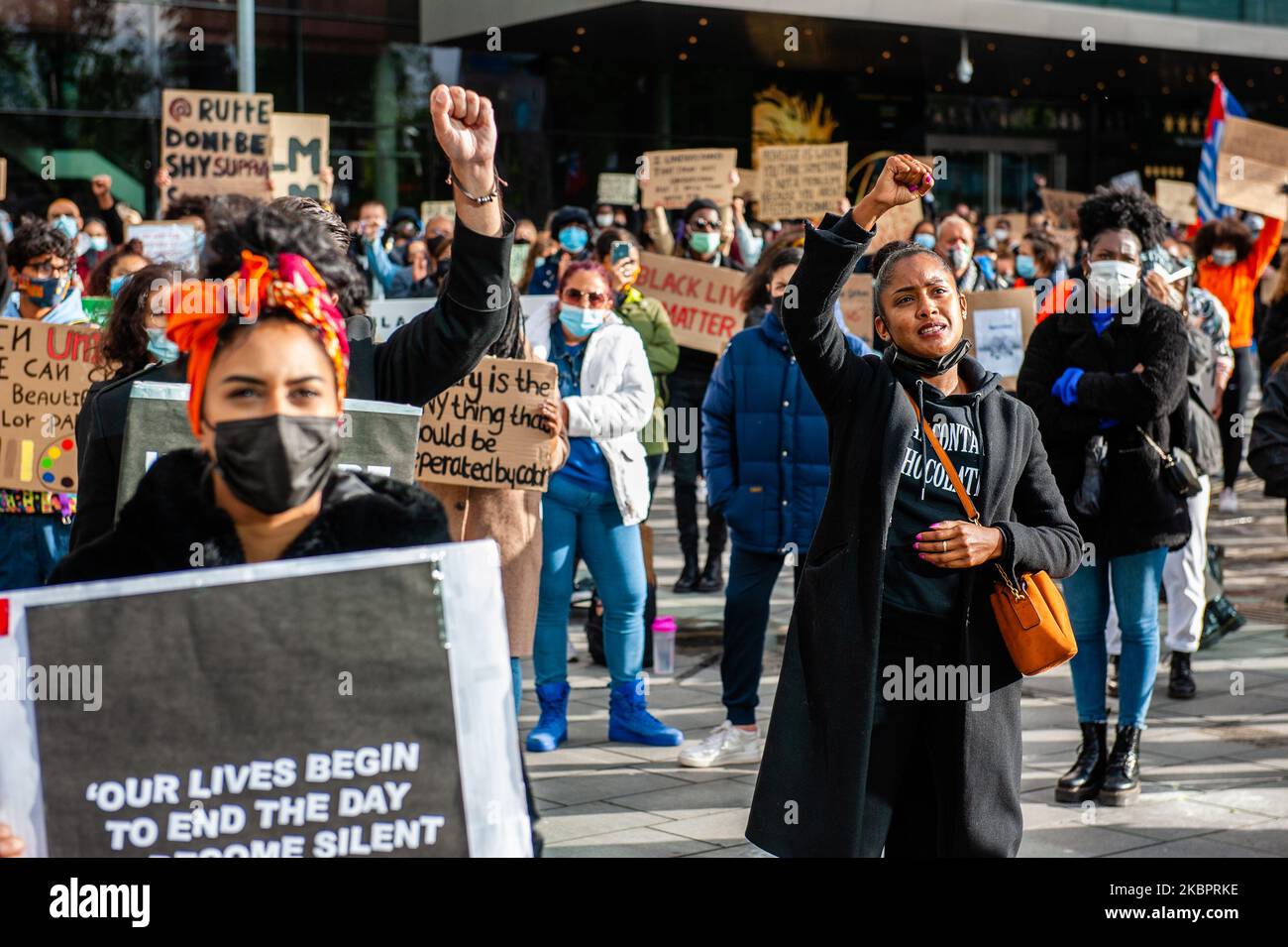 A black woman looks emotional during one of the speeches given during ...