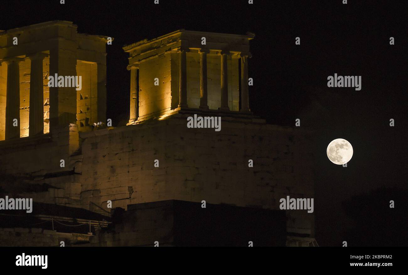 The Super Pink Moon rises over the Propylaea at the archaeological site ...