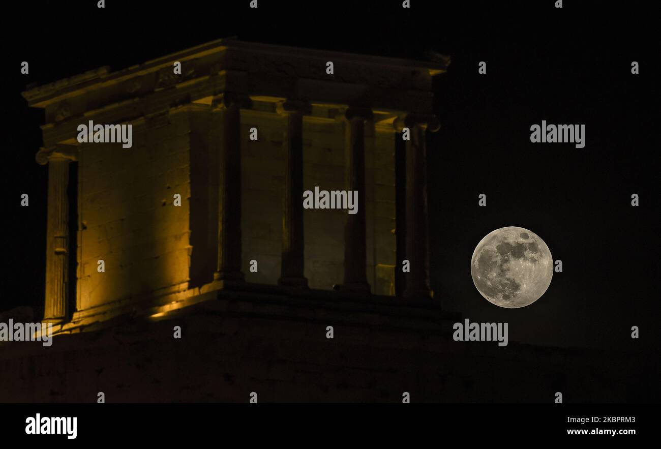 The Super Pink Moon rises over the Propylaea at the archaeological site ...
