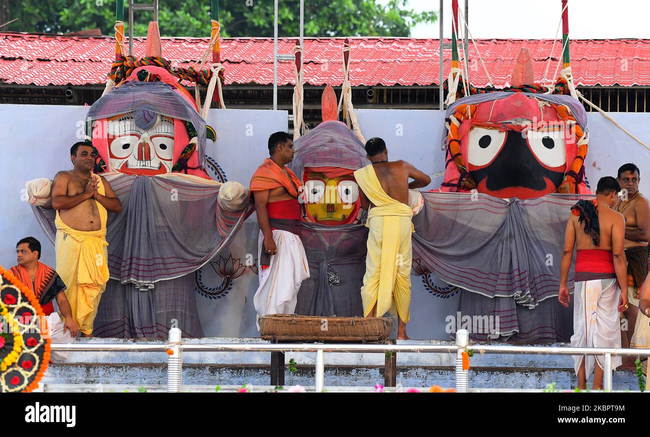 Temple Priests are seen near to the ditties of Lord Balabhadra (left ...