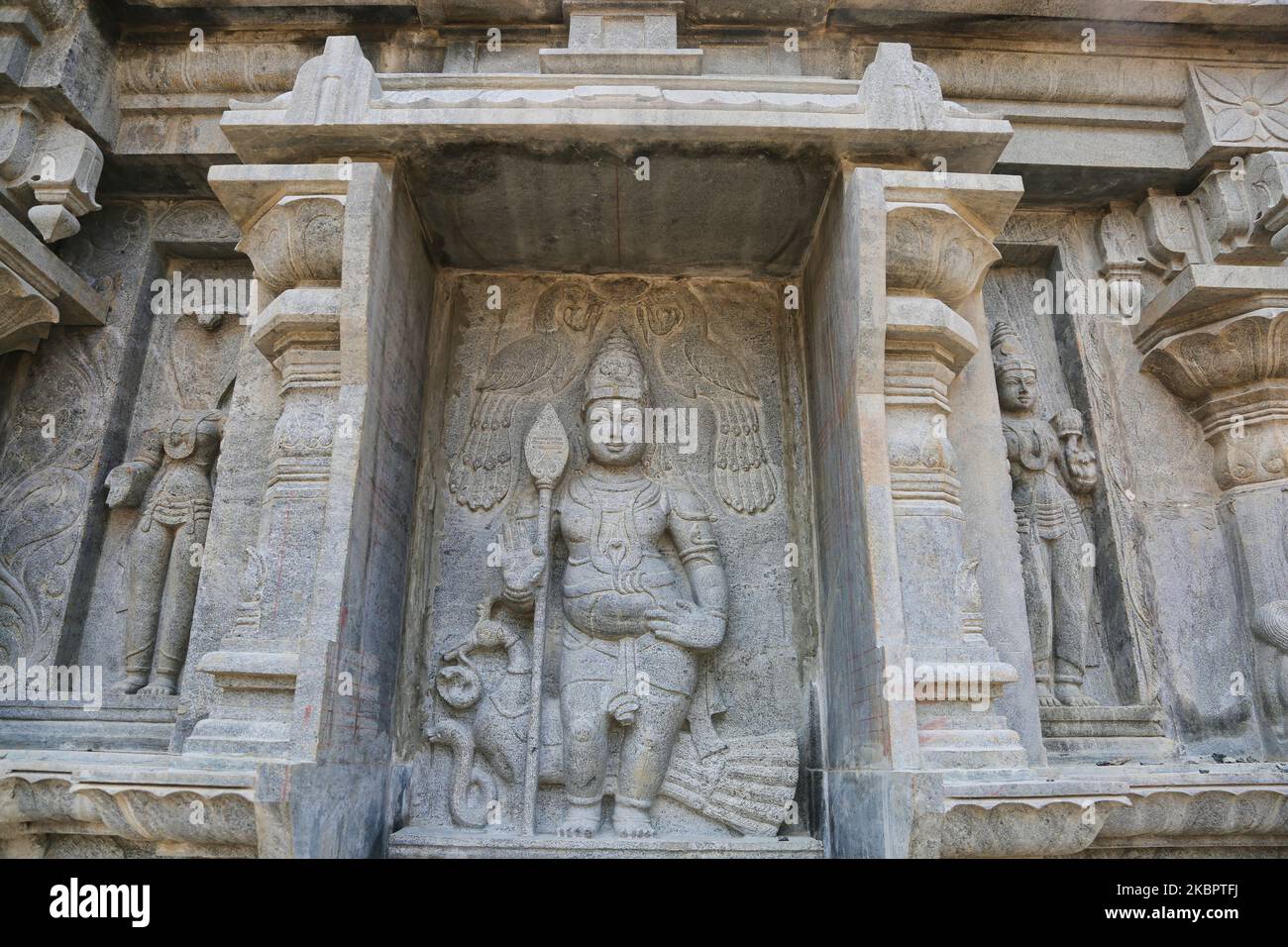 Stone figure of Lord Murugan adorns the raja gopuram tower of the Arul ...
