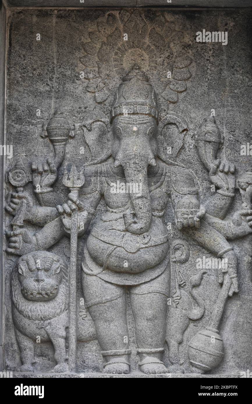 Stone figure of Lord Ganesh adorns the raja gopuram tower of the Arul ...
