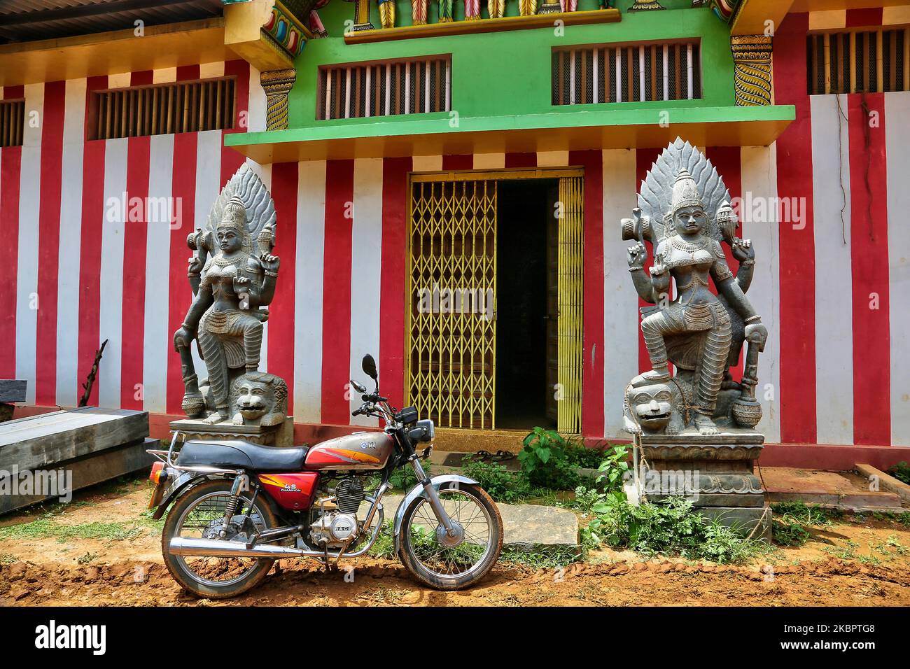 Statues of female guardian deities flanking the entrance of the Arul ...