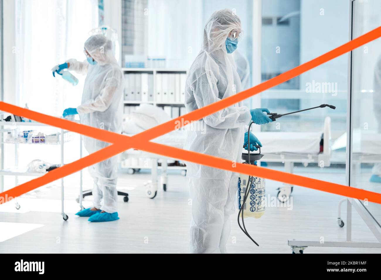 Covid, cleaning and red tape with medical team in hospital with ppe and ...