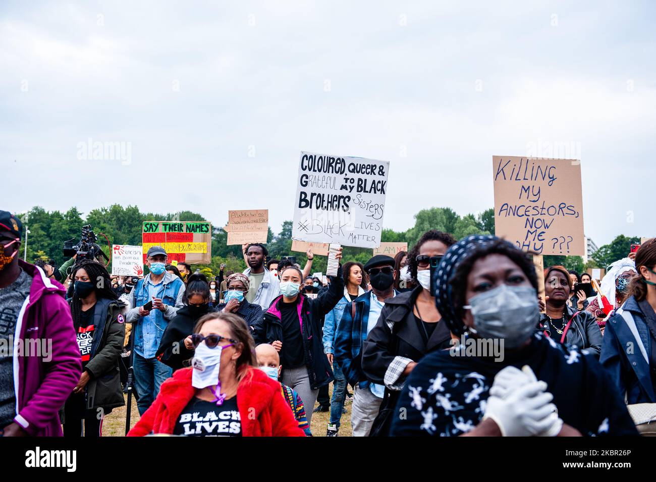 People are holding anti racist placards, during the second massive ...