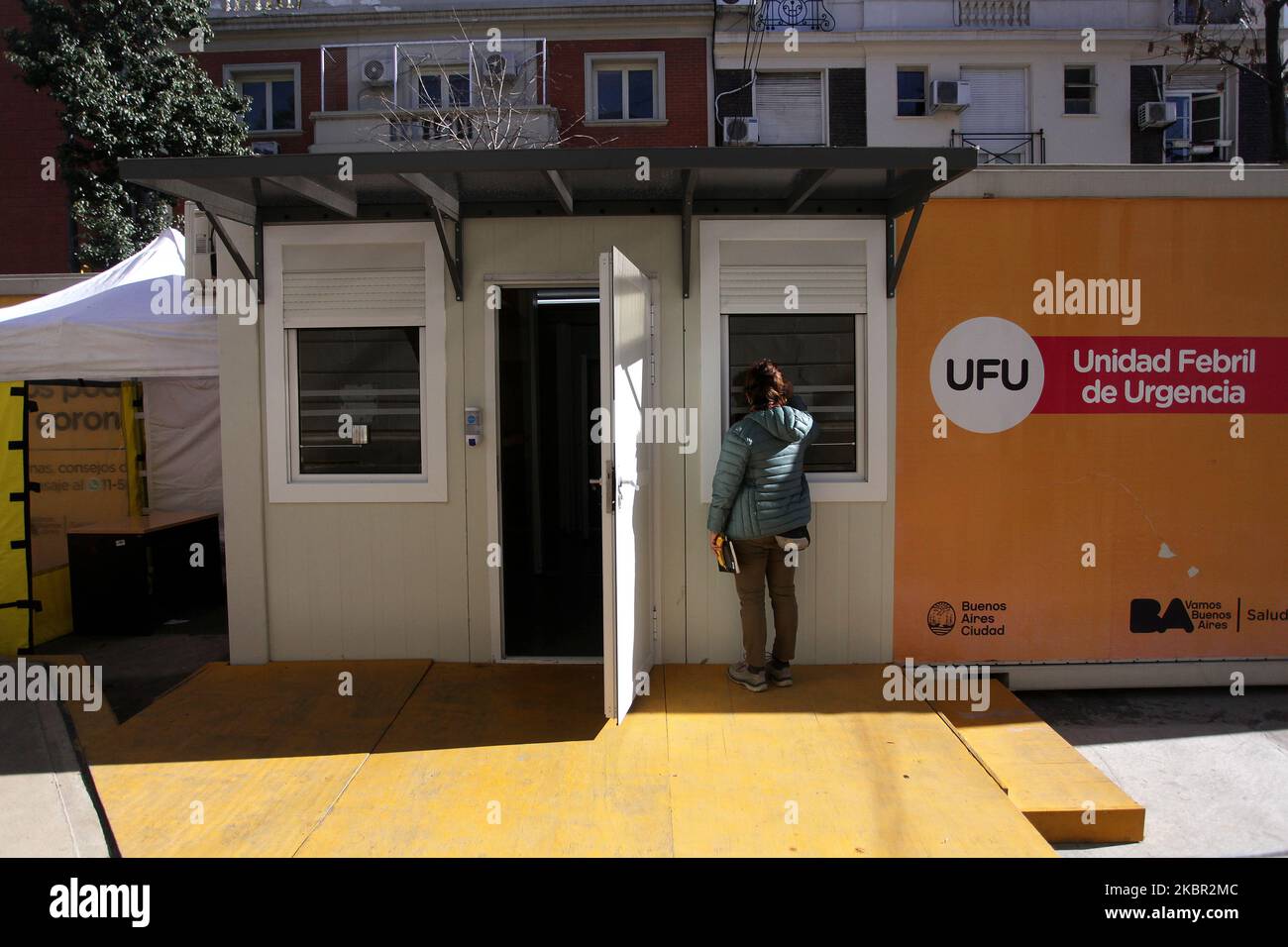 A woman waits to be treated at the Febrile Emergency Unit (UFU ...