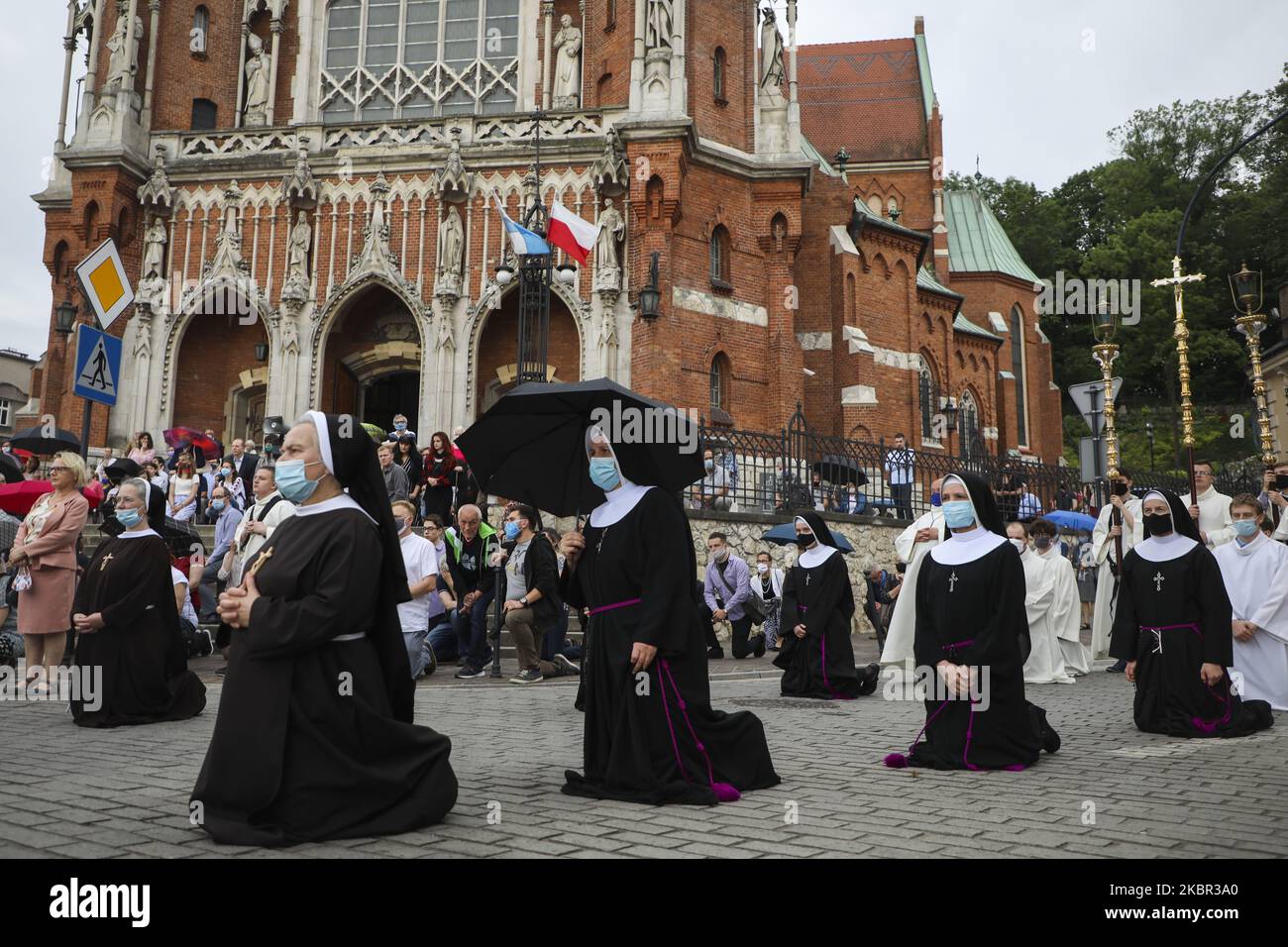 Catholics celebrate Corpus Christi by taking part in the procession ...