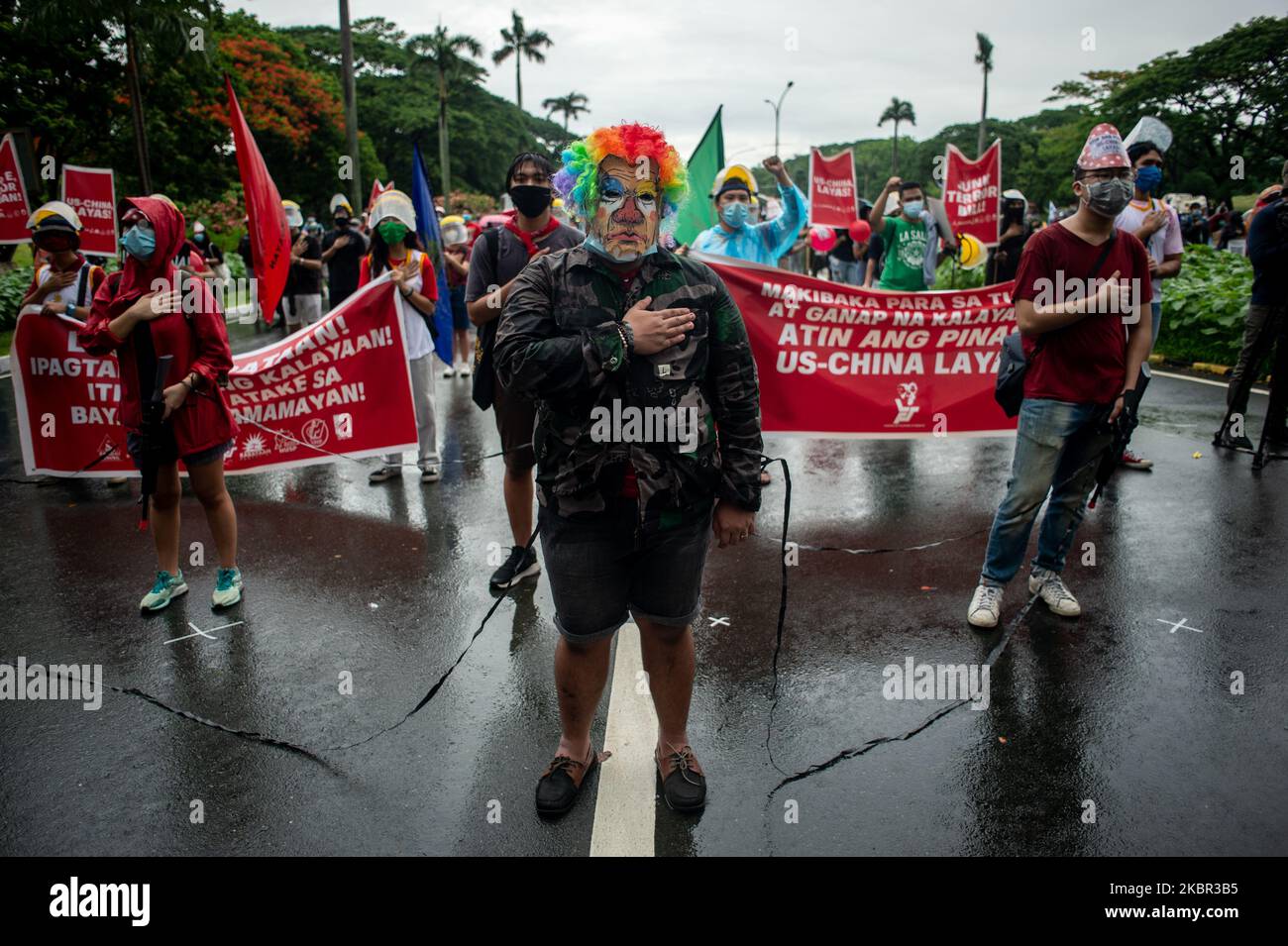 A man depicting Philippine President Rodrigo Duterte as a clown sings ...