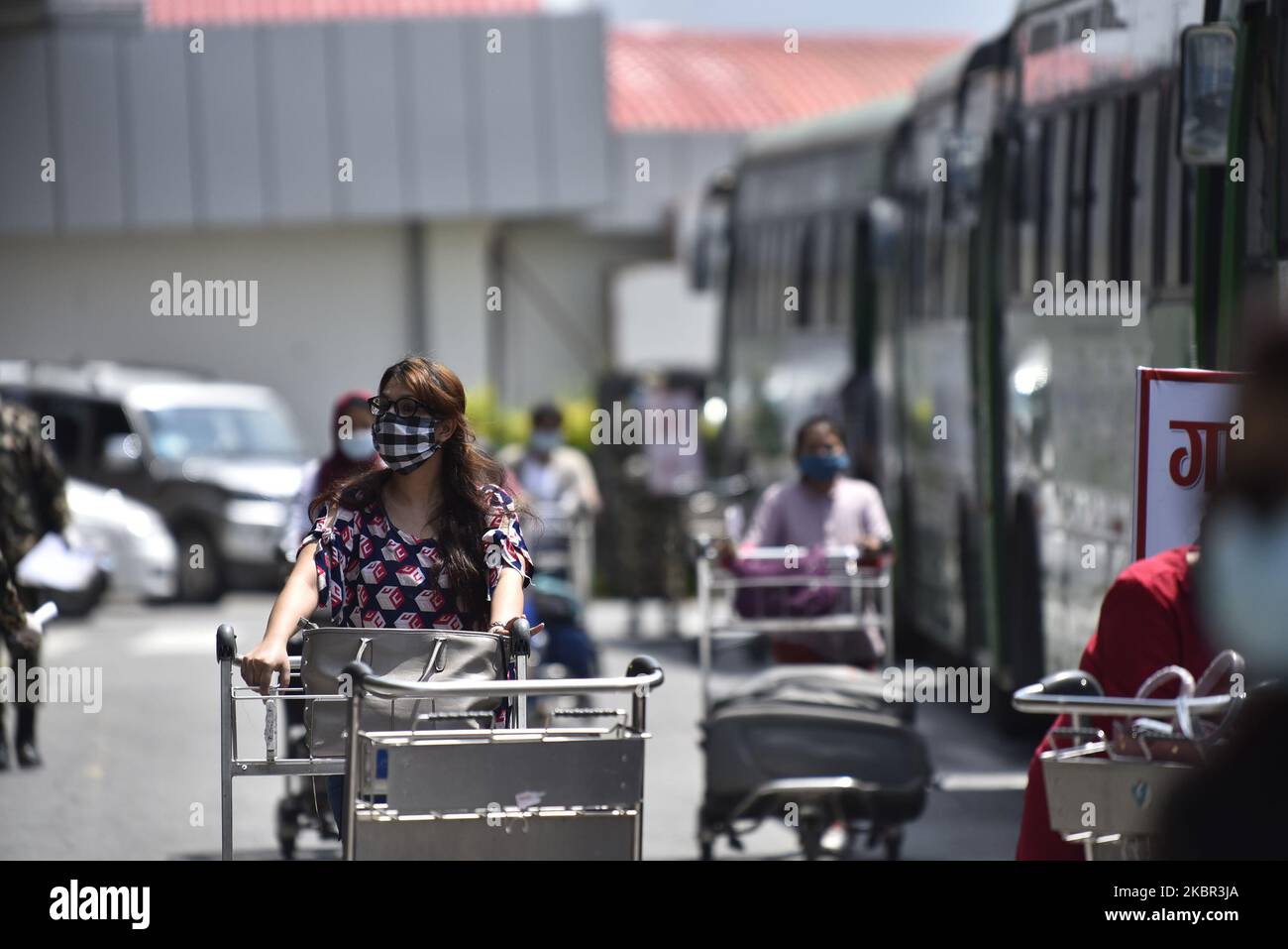 Nepalese workers arrive at the Tribhuvan International Airport from ...