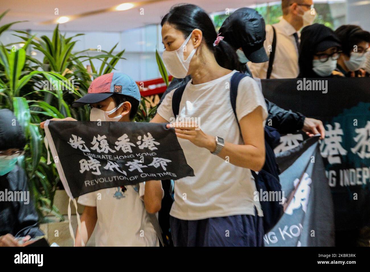 A mother and son join a lunchtime event in Pacific Place Mall ...