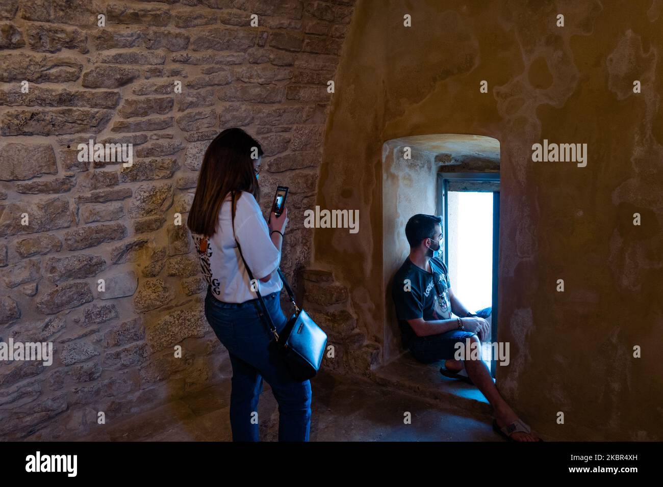 Visitors take photos inside the Passari Tower in Molfetta, Italy on ...