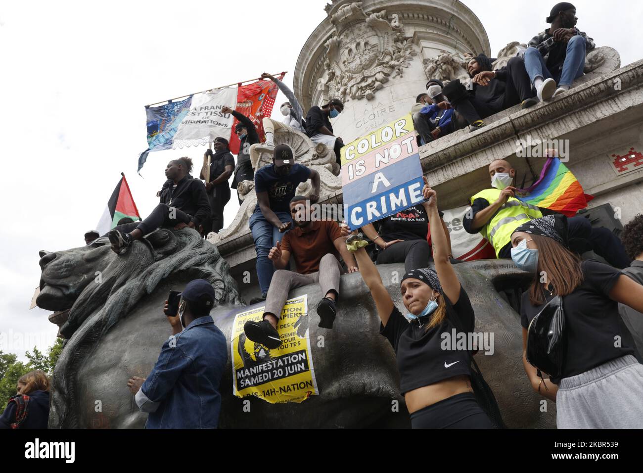 People raise their fists during a rally as part of the 'Black Lives ...