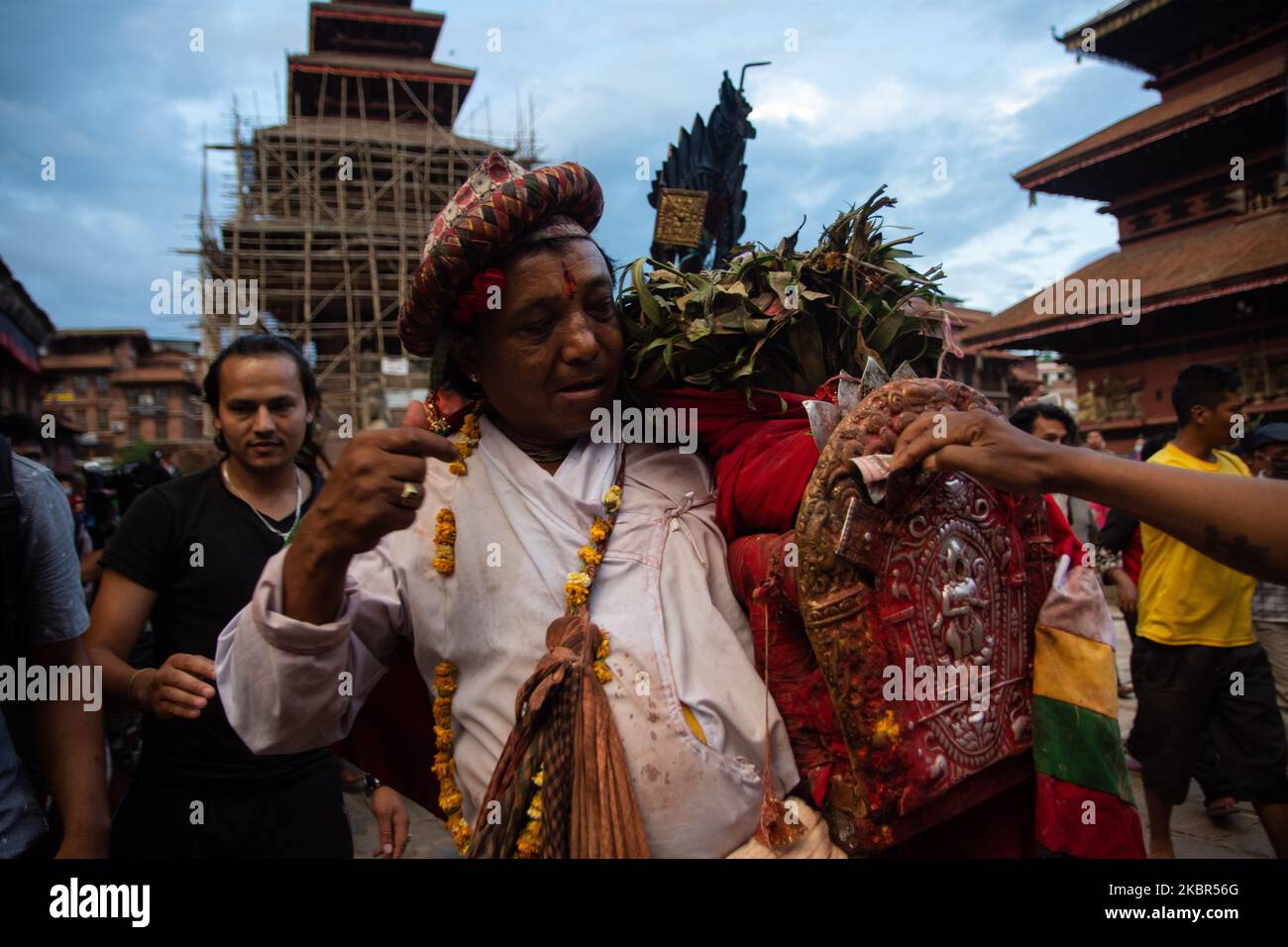 Nepalese Hindu priest dressed as a deity performs traditional ritual on ...