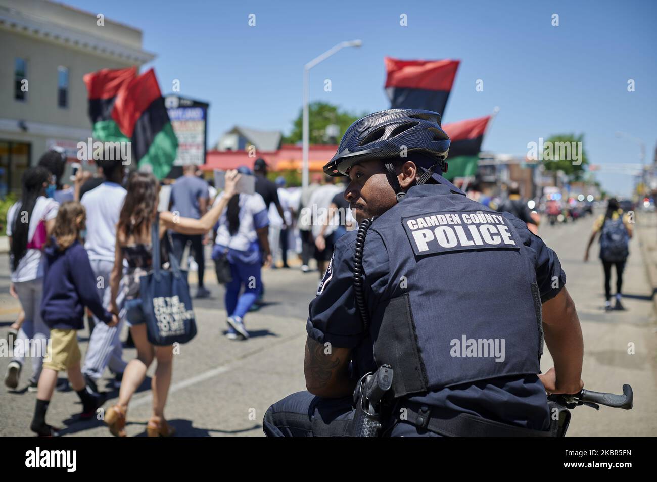 Police officers of the Camden County Police Department keep an eye out ...