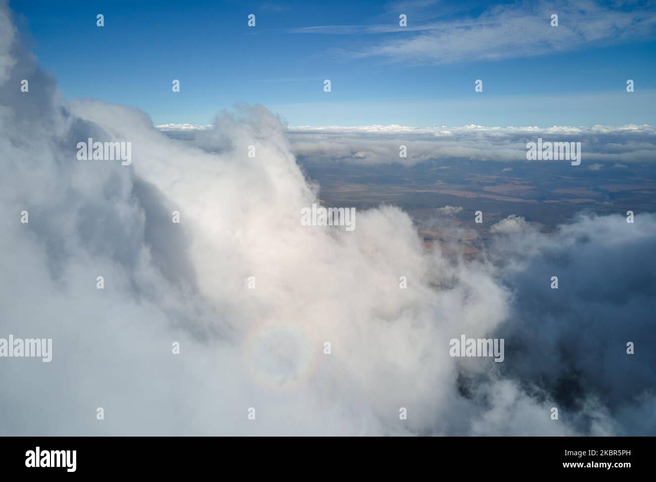 Aerial view from airplane window at high altitude of earth covered with ...